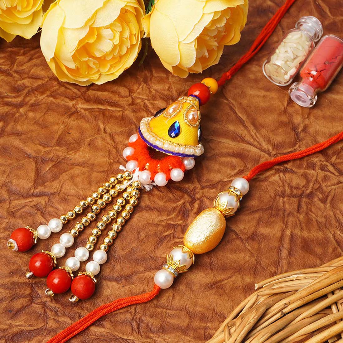 This Rakshabandhan buy Online Yellow Bell Meenakari & Pearl Rakhi Set ...